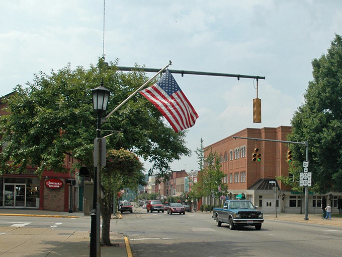 An American flag waves proudly over Cambridge's tree-lined street, where patriotism runs high and housing costs stay refreshingly low.