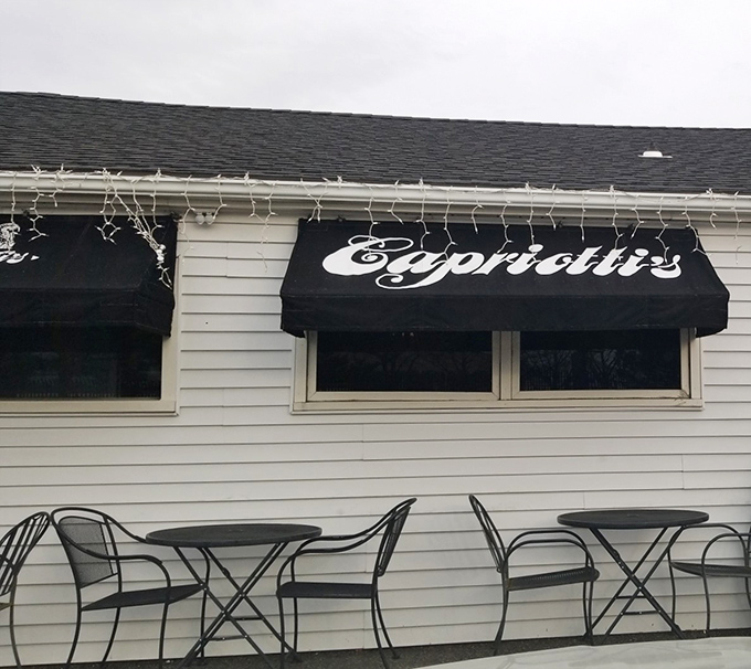 The black awnings of Capriotti's frame a doorway to sandwich heaven. Enter and leave your diet at the door.