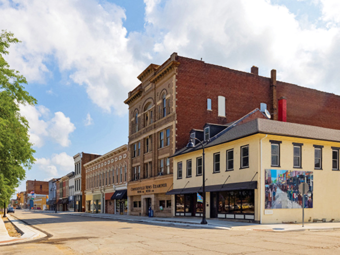 The warm brick tones of Connersville's main street buildings reflect both history and affordability. Retirement doesn't get more authentically Midwestern than this!