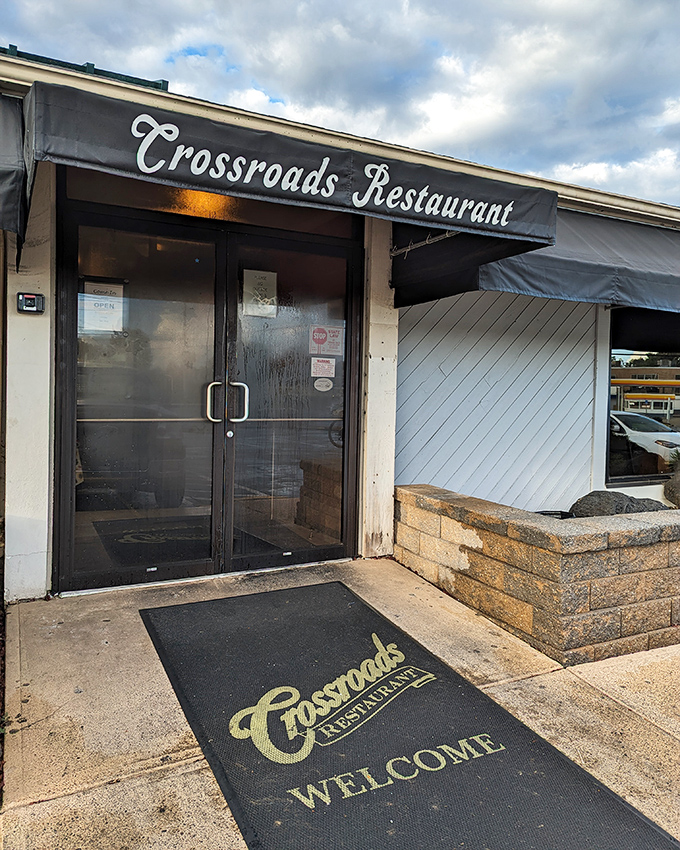 That "Welcome" mat at Crossroads isn't just polite – it's an invitation to burger heaven that locals have accepted for years.