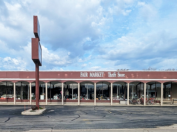 Sunlight plays across Fair Market's storefront, highlighting the promise of undiscovered treasures waiting just inside those windows.