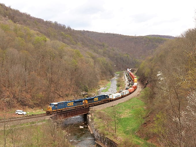 When freight trains snake through these mountains, it's industrial ballet at its absolute finest - pure poetry in motion.