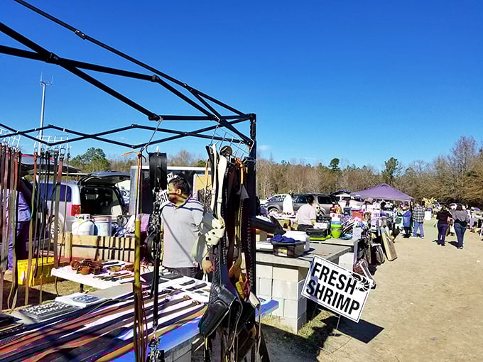 Vendors and shoppers create a bustling marketplace atmosphere at Florence Flea Market.