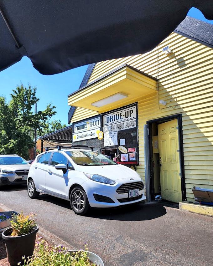 The drive-up window means hot dog happiness is just seconds away! That cheerful yellow building is like sunshine even on Portland's grayest days.