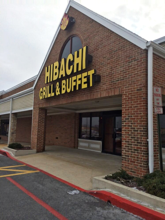 The Hibachi Buffet's brick facade might be understated by day, but those bold yellow letters speak volumes about the flavors inside.