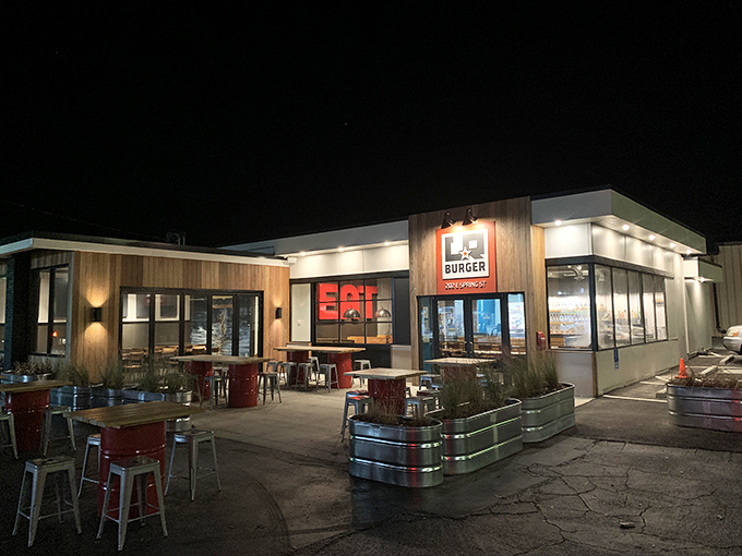 Night transforms LR Burger into a glowing beacon of beef brilliance. The illuminated "EAT" sign speaks the universal language of hunger.