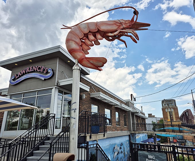 Lawrence's impressive shrimp sculpture stands tall against the sky—a fitting monument to their perfectly fried seafood.