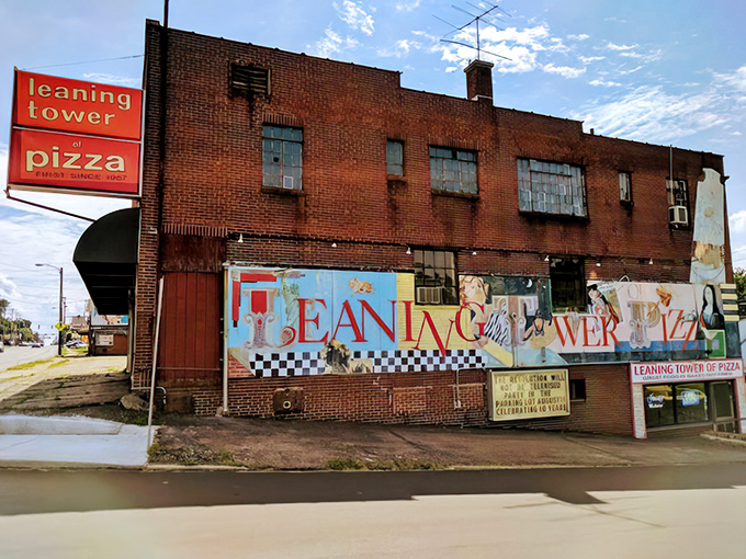 That colorful mural and vintage brick building aren't just for show. Leaning Tower has been serving up serious pizza magic for generations.