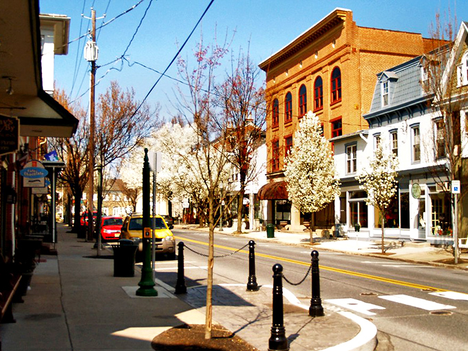 Spring blossoms frame Lititz's Main Street, where historic architecture and small-town charm create a postcard-perfect scene.