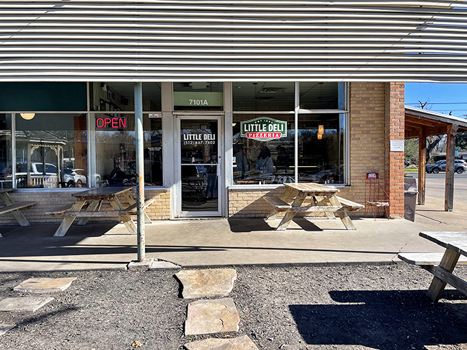 That classic "OPEN" sign at Little Deli might as well say "Welcome Home." Austin's sandwich gem hides in plain sight.