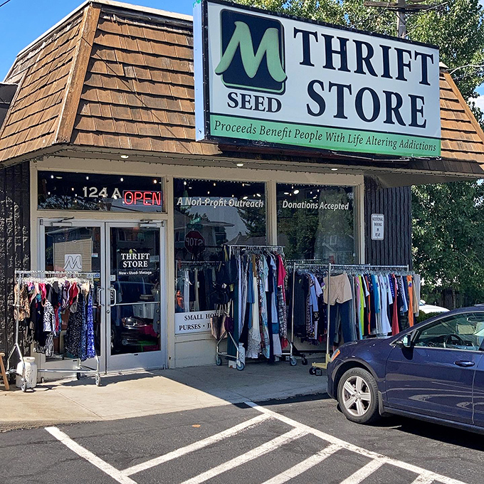 Clothing racks spill onto the sidewalk at M Seed, offering a preview of the bargains waiting inside.