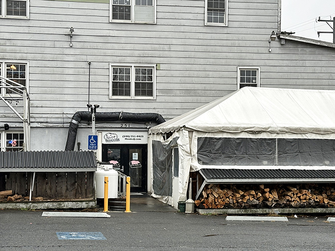 Monk's understated entrance hides a world of smoke and flavor. That tent means business is good&mdash;very good.