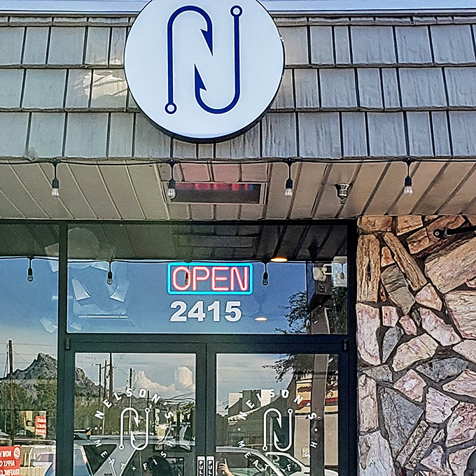 The minimalist hook logo at Nelson's speaks volumes. This isn't just a store&mdash;it's a seafood sanctuary for those in the know.