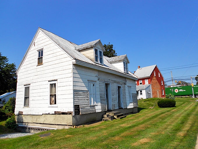 Weathered white clapboard whispers stories of generations past in New Holland's architectural time capsule.