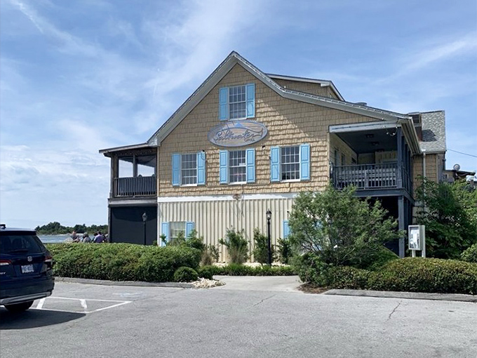 Those blue shutters aren't just decorative&mdash;they're framing some of the best seafood views in Swansboro.