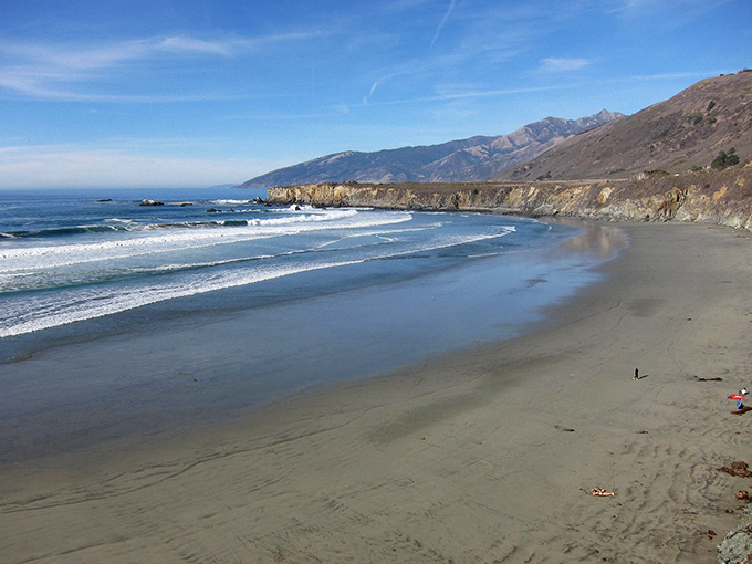 Morning fog plays hide-and-seek with the cliffs at Sand Dollar Beach, creating moments of pure magic.