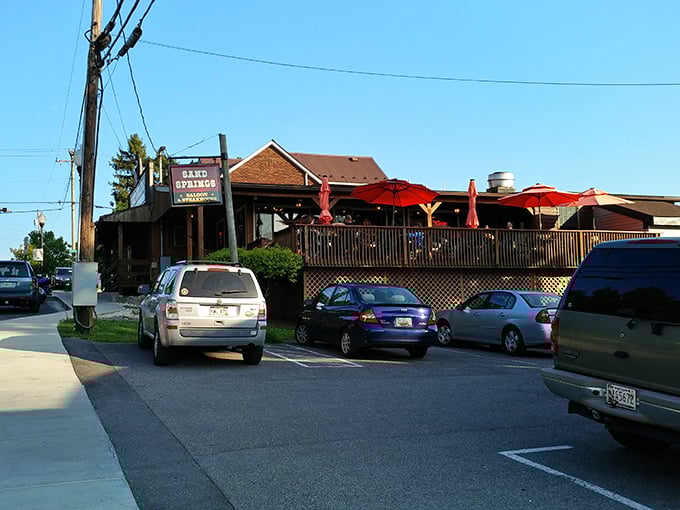 The outdoor deck at Sand Springs offers mountain views that pair perfectly with their flame-grilled steaks and hometown hospitality.