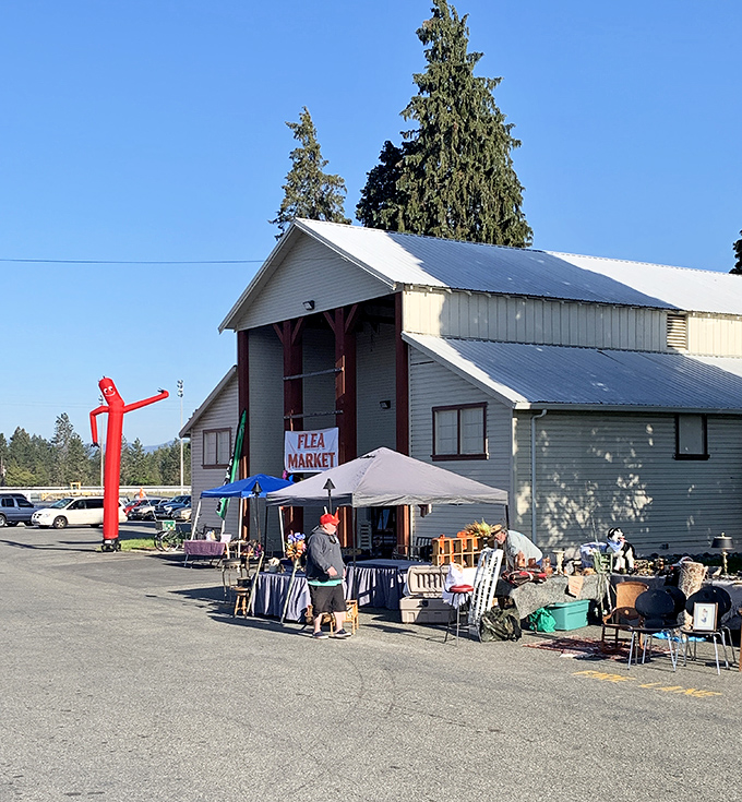 Southern Oregon Flea Market combines fairground charm with serious bargain hunting. That smiling yellow sentinel knows what awaits inside!