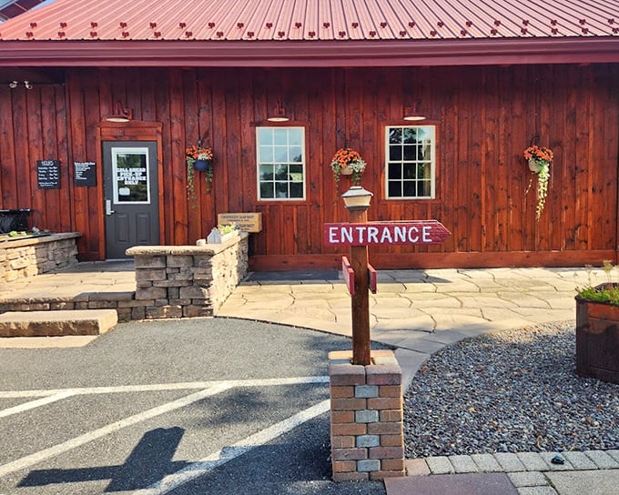 The 'ENTRANCE' sign seems unnecessary when your nose can follow that smoky siren call from the parking lot.