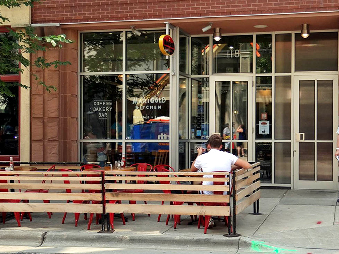 The sidewalk seating at Marigold Kitchen transforms ordinary mornings into mini-vacations. Coffee tastes better with a side of people-watching.