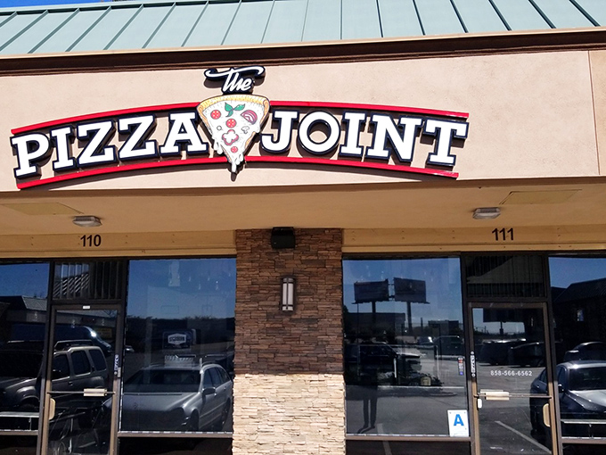 No pretension, just pizza perfection &ndash; The Pizza Joint's sign tells you everything you need to know about their straight-shooting approach.