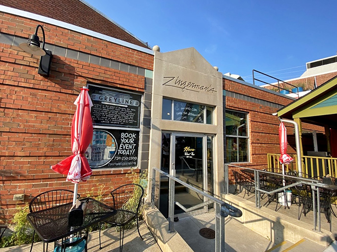 The modern patio entrance to Zingerman's &ndash; where sandwich pilgrims gather to worship at the altar of deliciousness.