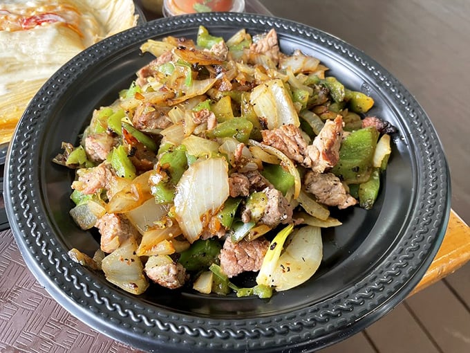 The alambre de filete combines steak, peppers, and onions in a sizzling performance that deserves a standing ovation from your taste buds.