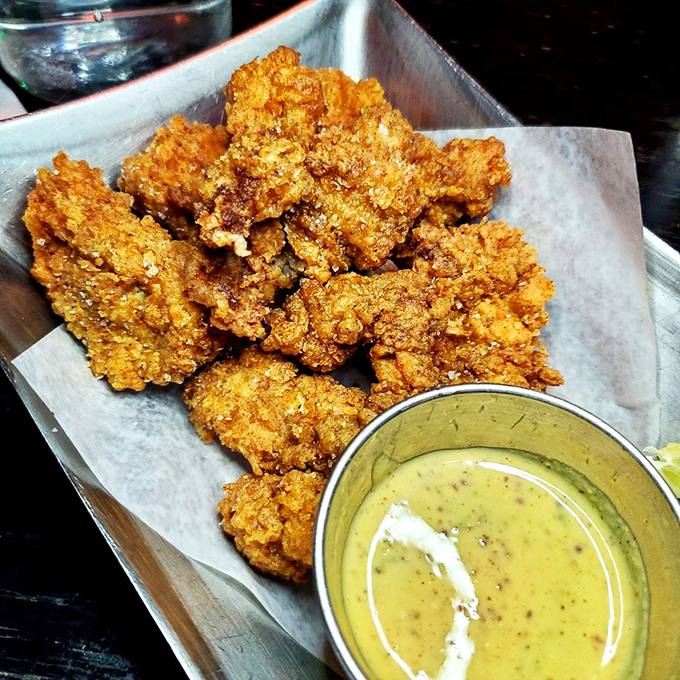 Florida on a plate! Crispy alligator bites transform the local reptile into a delicacy that tastes like the sophisticated cousin of chicken nuggets.