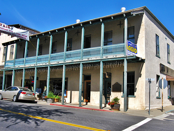 The Angels Hotel's turquoise balcony railing pops against neutral walls&mdash;a Victorian-era influencer that understood the power of a signature color.