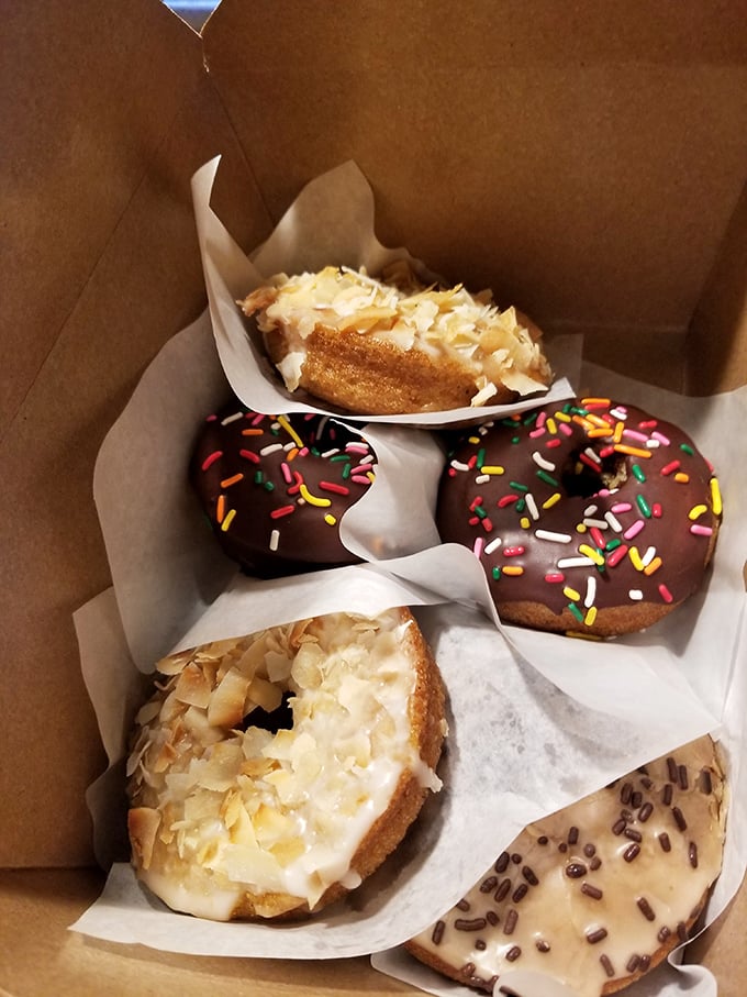 A box of donuts that makes you understand why police officers never mind the stereotype. The chocolate-dipped ones with sprinkles are calling your name.