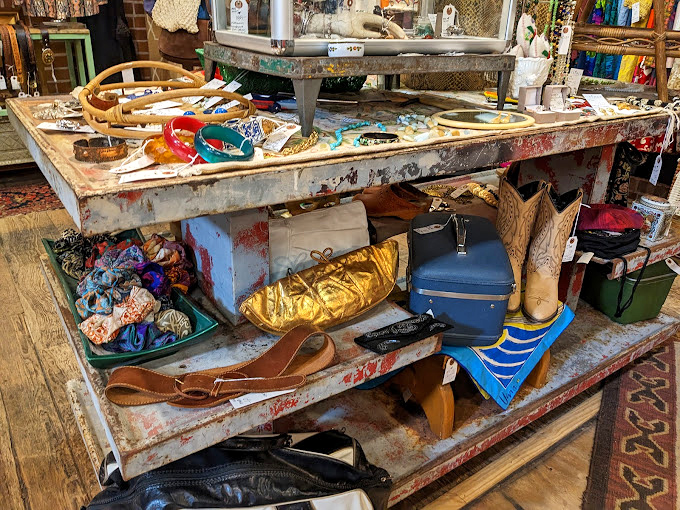 Beneath that magnificent pendant light, a geometric credenza anchors a vignette that screams "mid-century modern meets Southwestern elegance."