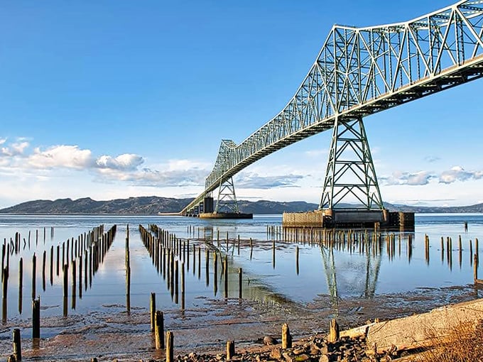 The Astoria-Megler Bridge spans four miles of Columbia River like a steel rainbow connecting two states.