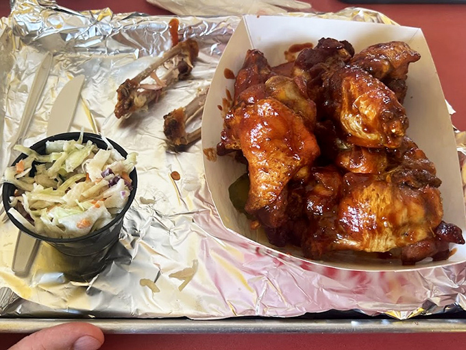 Wings that have clearly been introduced to fire and smoke before meeting their saucy destiny&mdash;a delicious transformation worth celebrating.