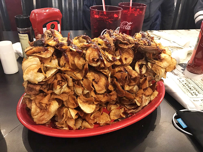 A mountain of homemade potato chips that makes you wonder if you've died and gone to crispy, crunchy heaven.