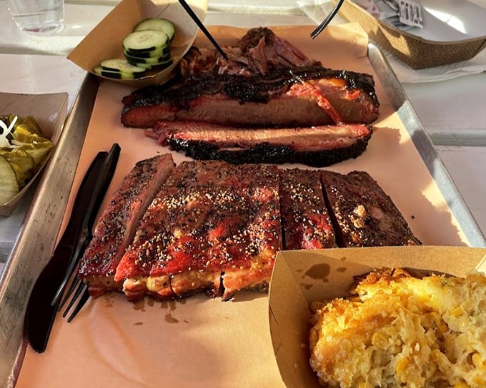 Ribs and mac & cheese: a romance for the ages. That bark-covered meat pulling cleanly from the bone is the barbecue equivalent of a perfect sunset.