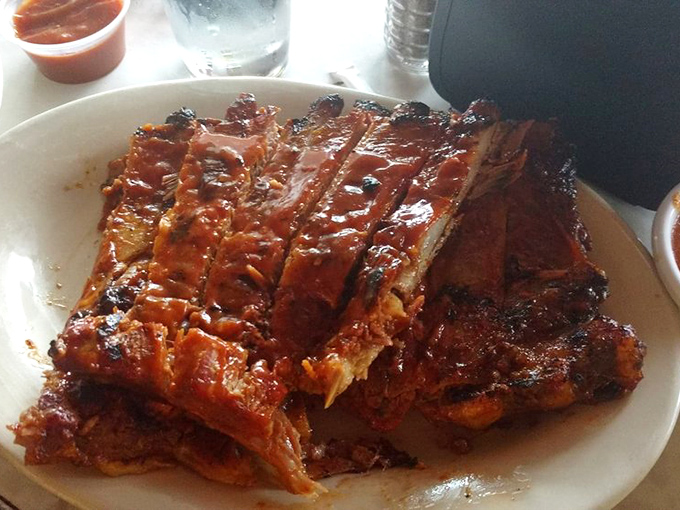 Ribs so perfectly lacquered they belong in a museum, except museums don't allow that kind of passionate, audible appreciation.