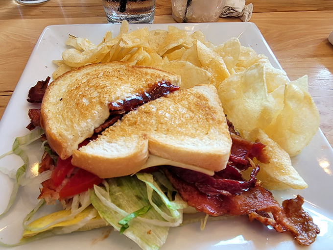 The humble BLT elevated to art form. Perfectly toasted bread, crispy bacon peeking out, and fresh greens &ndash; simplicity that somehow manages to be extraordinary.