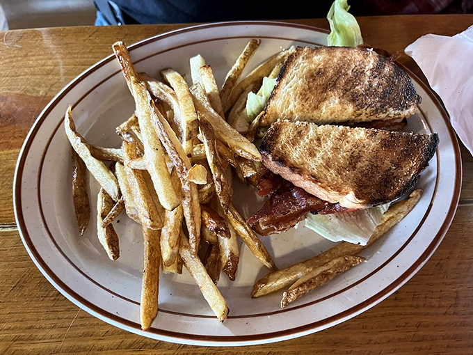 The BLT—a sandwich so perfect it needs only three letters. Those hand-cut fries aren't just sides; they're co-stars deserving equal billing.