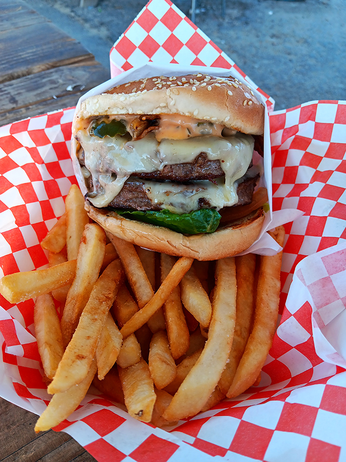A Swiss cheeseburger that takes both hands and a game plan. This towering masterpiece of beef and melty cheese commands respect&mdash;and plenty of napkins.
