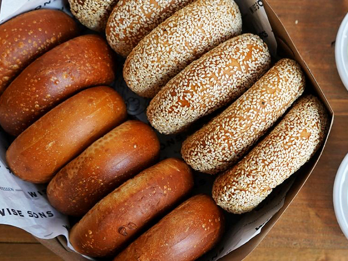 Bagels lined up like edible works of art. The sesame-to-plain ratio is mathematically perfect for indecisive orderers everywhere.