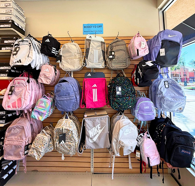 Colorful backpacks lined up like eager puppies at an adoption center, each one practically begging, "Pick me for your next adventure!"