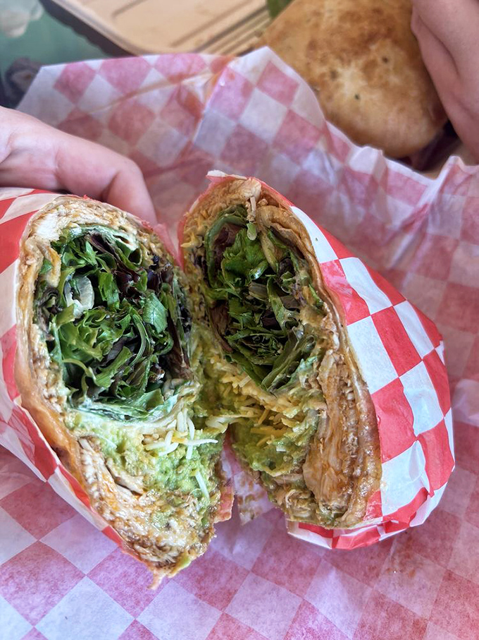 Fresh greens peeking out of a perfectly wrapped tortilla&mdash;proof that healthy choices don't have to be boring. This wrap means business.