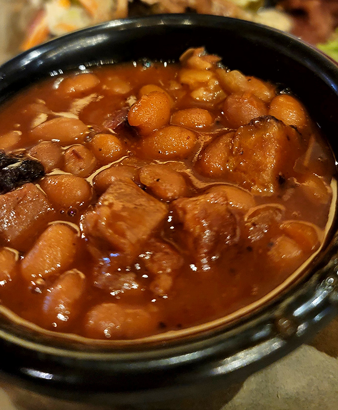 These baked beans have clearly been hanging out with the right crowd – chunks of meat turning an ordinary side into something extraordinary.