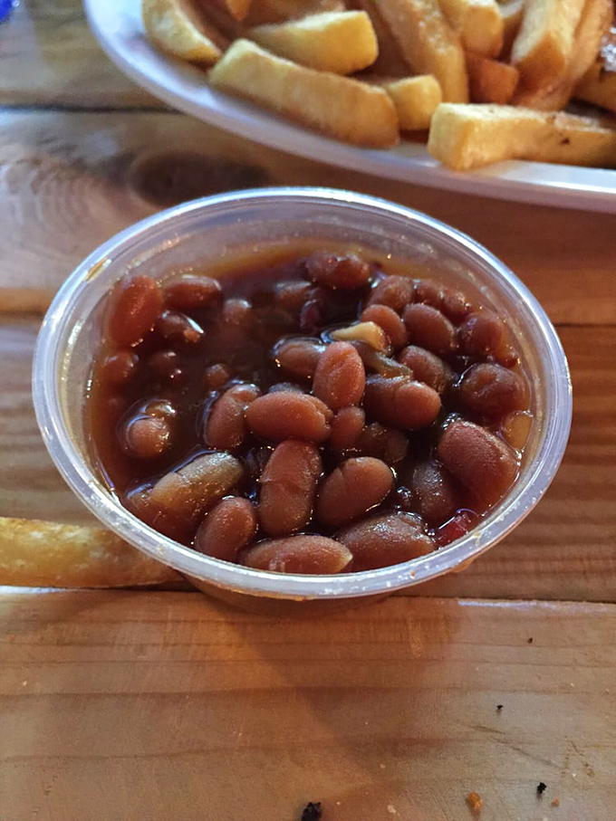 These aren't your sad canned baked beans. Each spoonful delivers a complex symphony of sweet, savory, and smoky notes that dance across your palate.