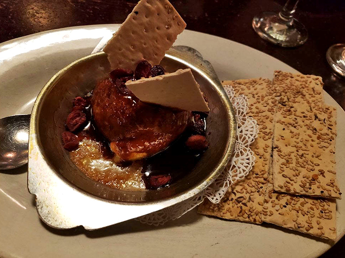 Baked brie wrapped in puff pastry with crackers &ndash; because sometimes sophisticated comfort food requires no apologies.