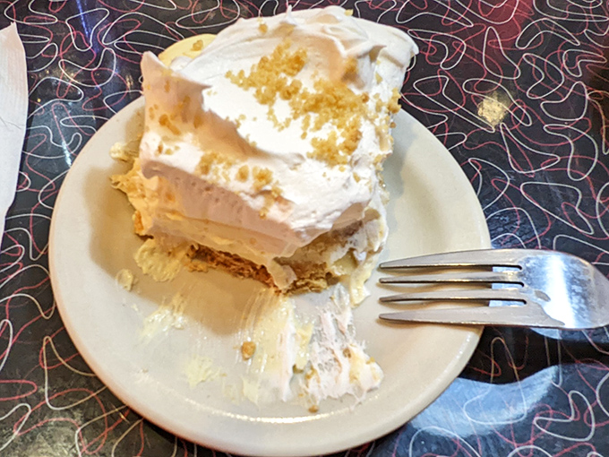 Half-eaten banana cream pie that tells the story of good intentions ("I'll just have one bite") versus delicious reality ("I regret nothing").