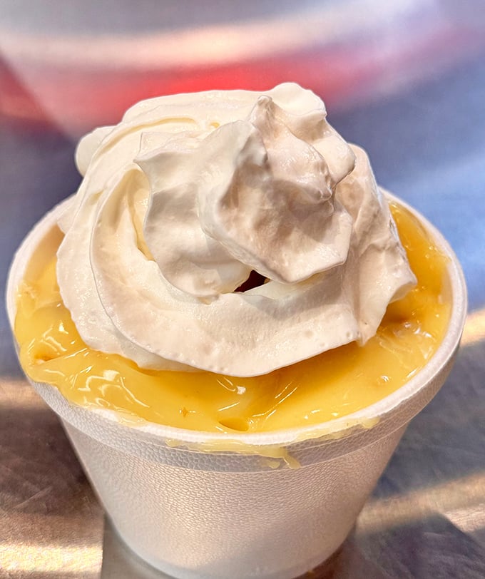 Banana pudding that stops conversations mid-sentence. That cloud of meringue floating on sunshine-yellow custard is pure Southern poetry.