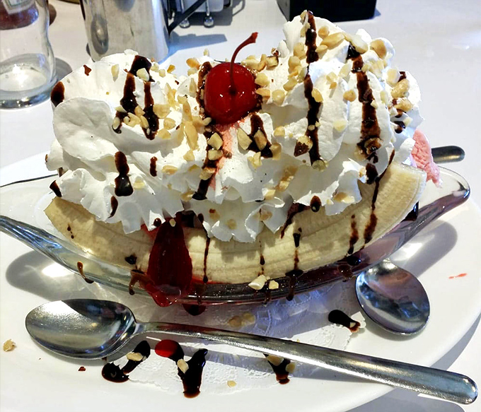 This banana split isn't just dessert&mdash;it's architecture, sculpture, and pure joy, all in a boat-shaped dish that's begging to be shared but too good to actually share.