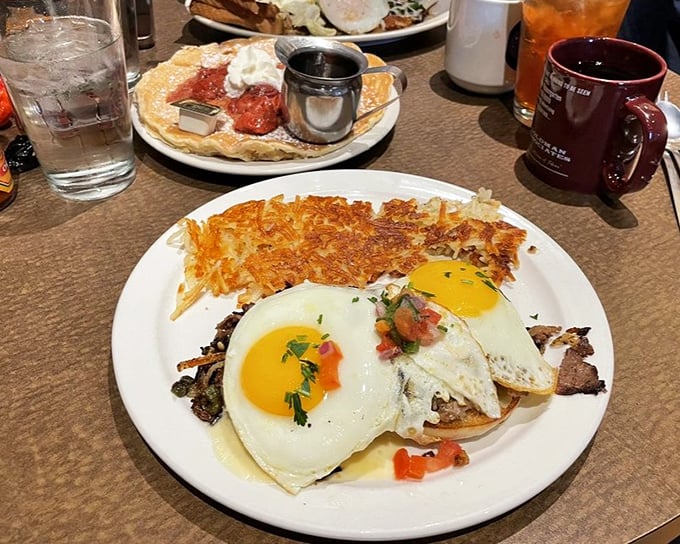 Sunny-side eggs crown this hearty breakfast skillet like jewelry, while crispy potatoes create the foundation every morning masterpiece deserves.