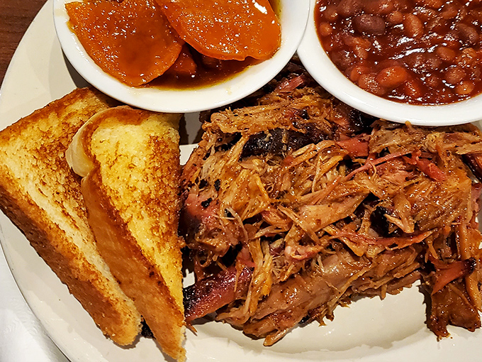 Pulled pork that's been smoking longer than most rock bands, paired with beans that could make a Texan tip their hat in respect.